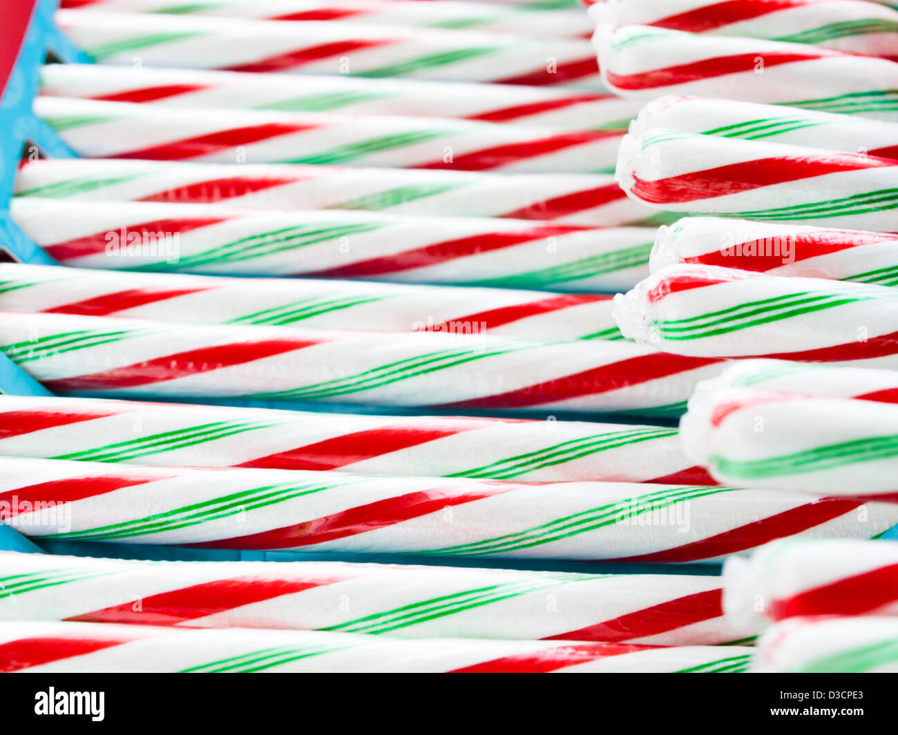 White, red and green peppermint candy canes in a box Stock Photo - Alamy