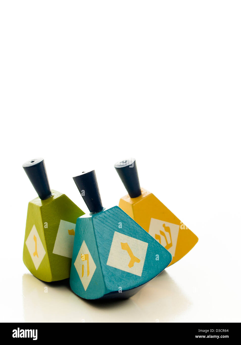 Colorful dreidels on white background Stock Photo - Alamy