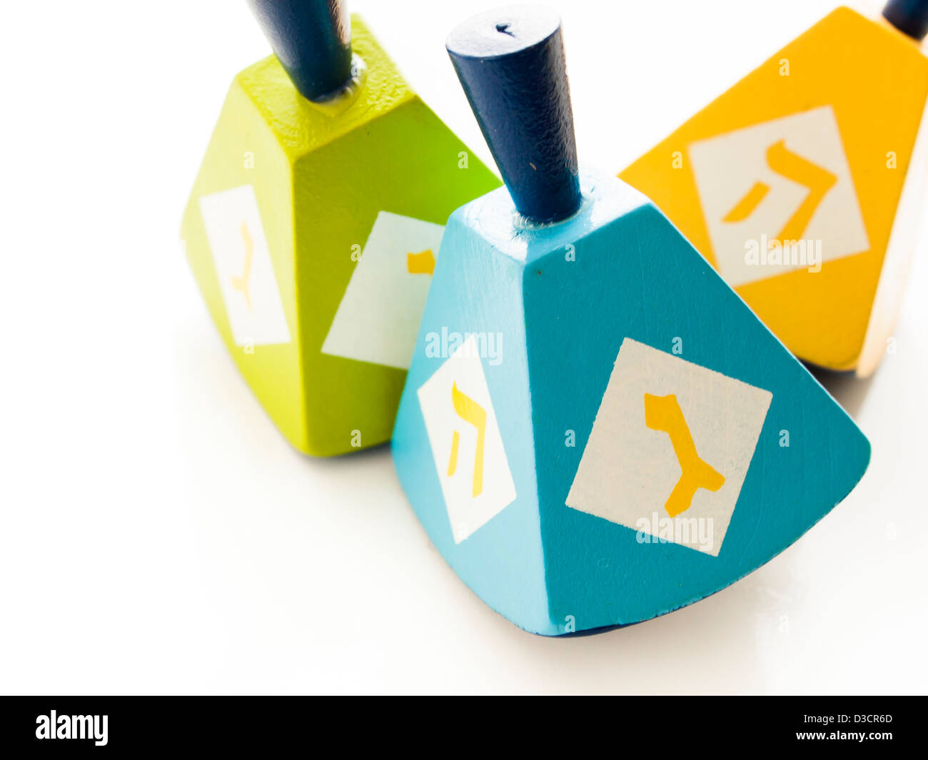 Colorful dreidels on white background Stock Photo - Alamy