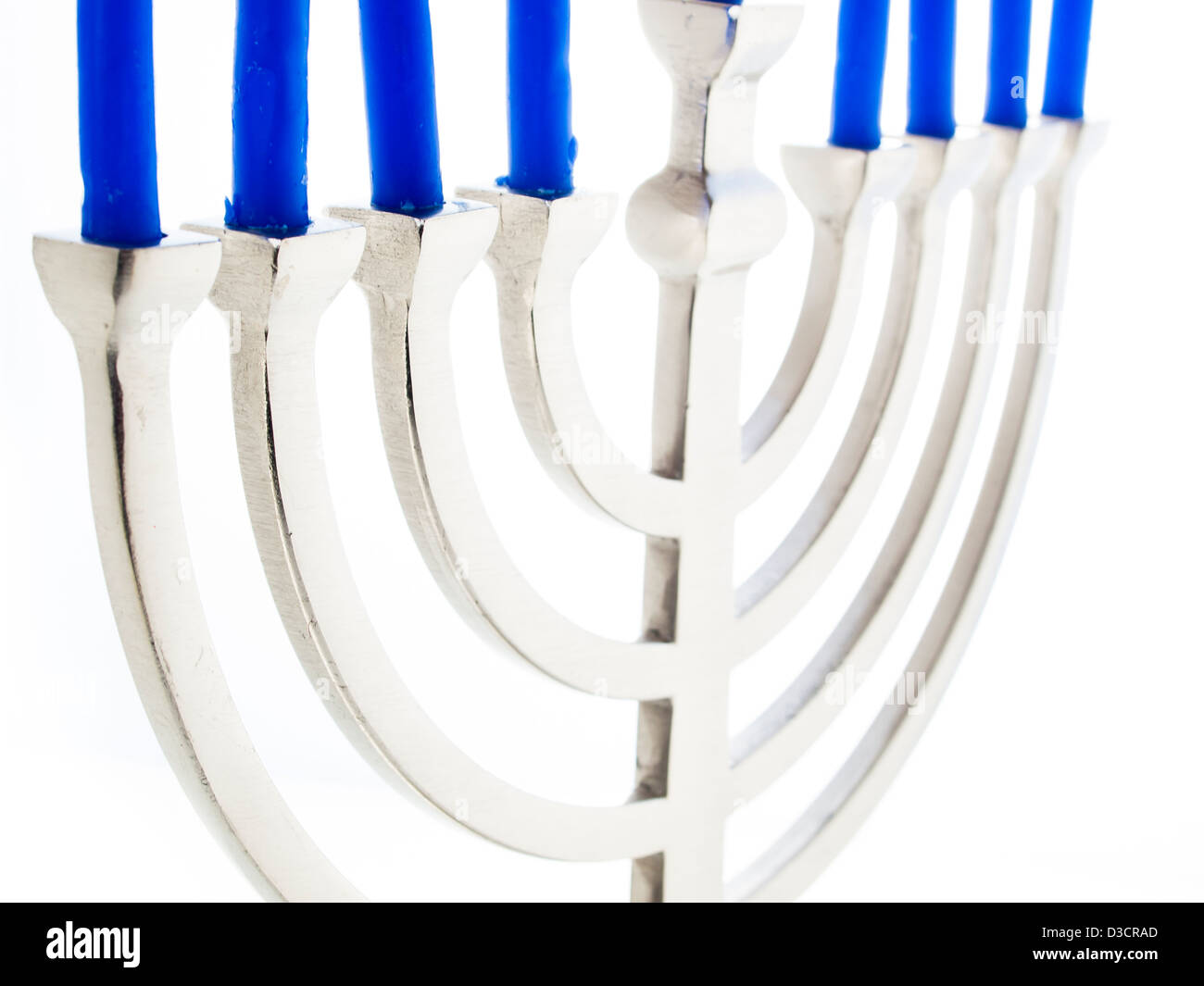Contemporary menorah with blue candels on white background Stock Photo ...