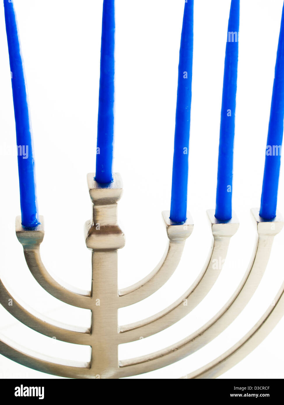 Contemporary menorah with blue candels on white background Stock Photo ...