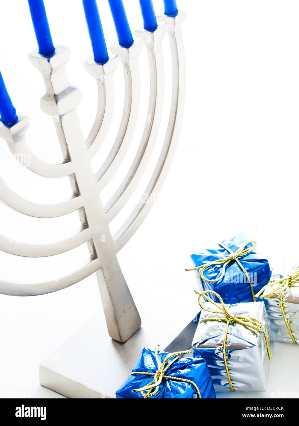 Contemporary menorah with blue candels on white background Stock Photo ...