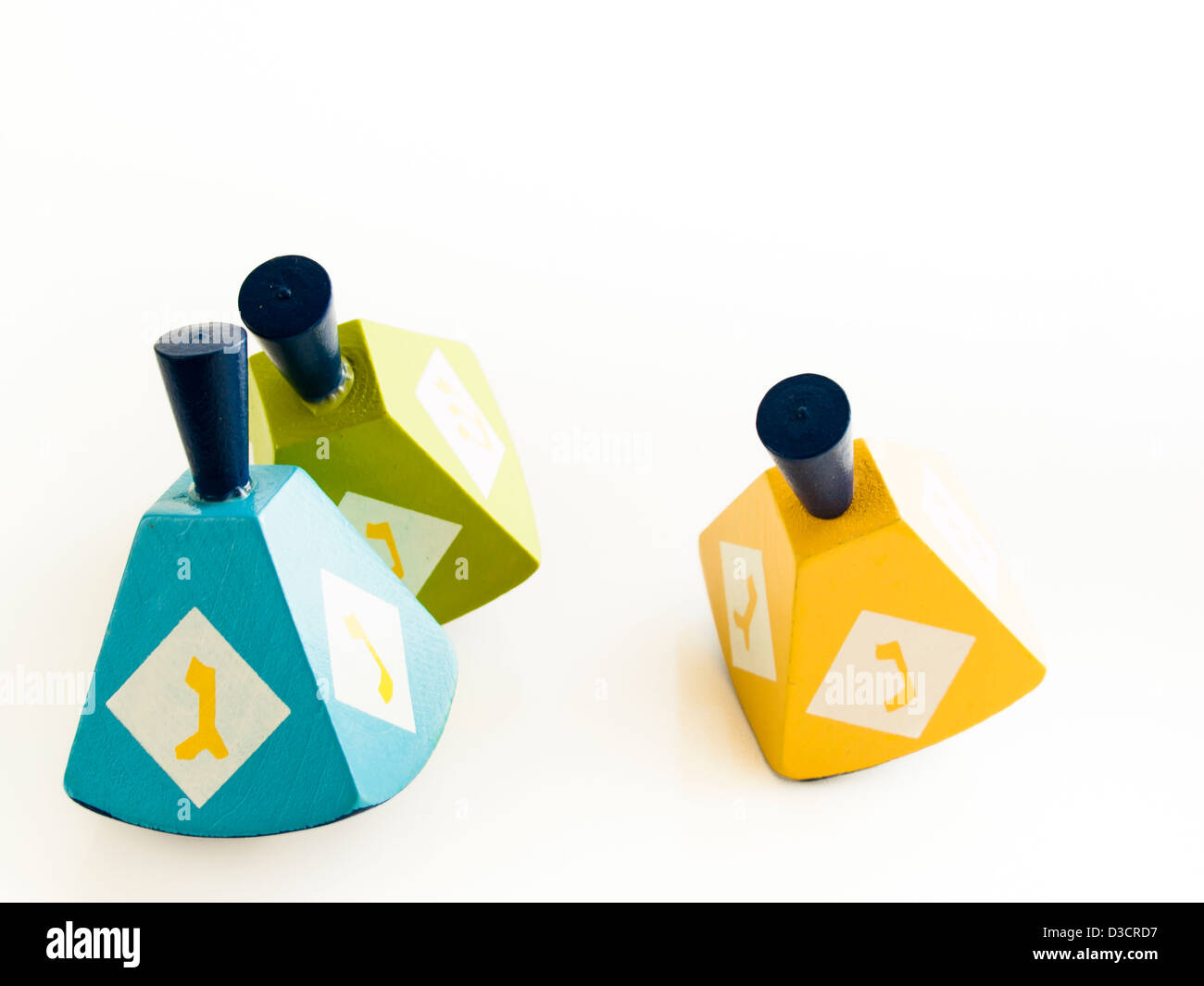 Colorful dreidels on white background Stock Photo - Alamy