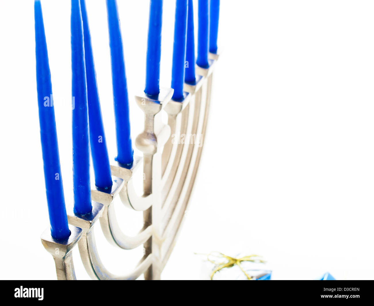 Contemporary menorah with blue candels on white background Stock Photo ...