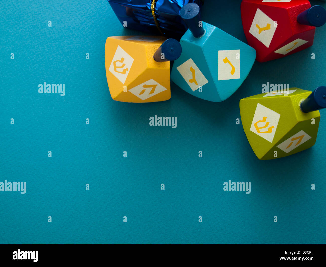 Colorful dreidels with presents on blue background Stock Photo - Alamy