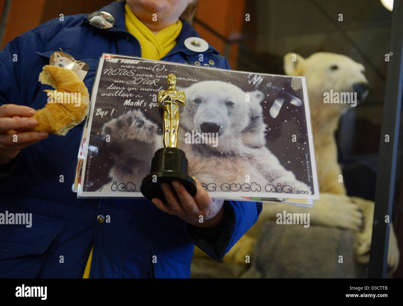 WRONG DATE - Karin Gude-Kohl hold an Oscar award replica being ...