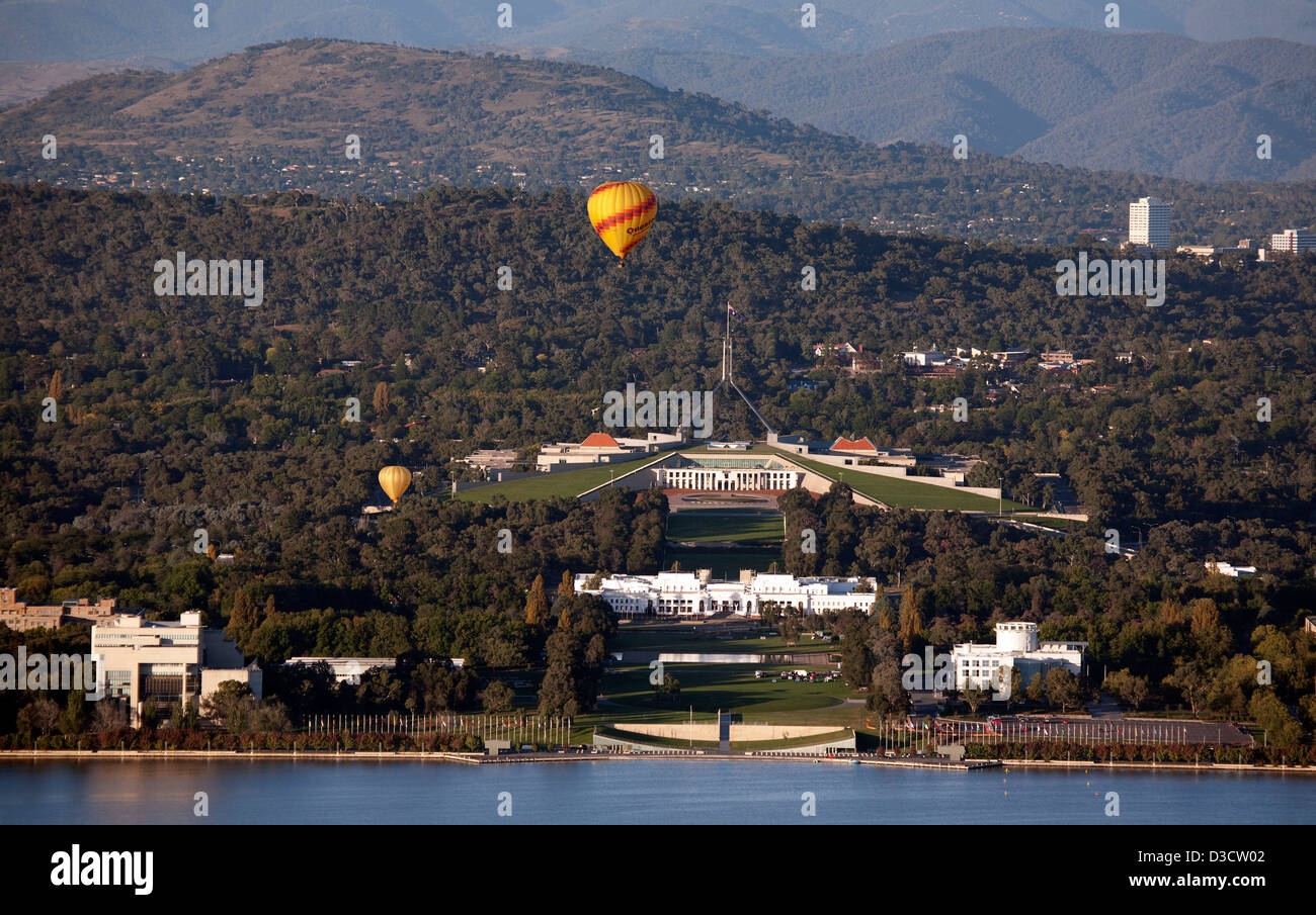 Hot Air Ballooning over Lake Burley Griffin with Parliament House on Capital Hill in the ...