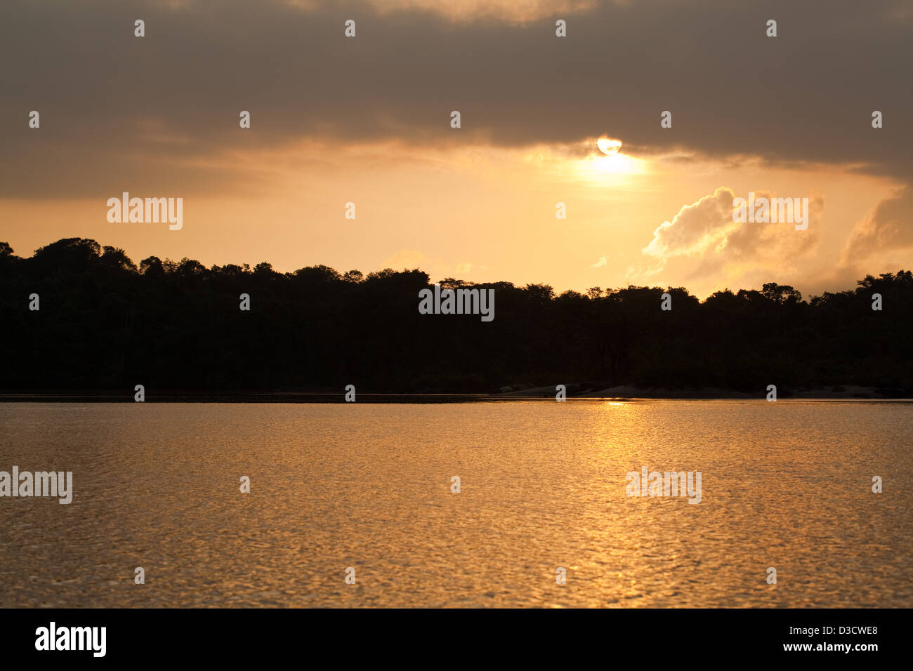 Sunset and rain clouds across the River Essequibo. North Rupununi ...