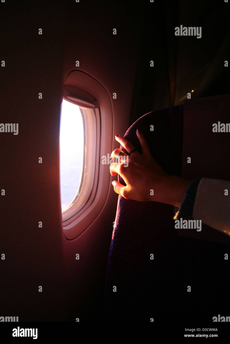 Window of the plane and female hand Stock Photo - Alamy
