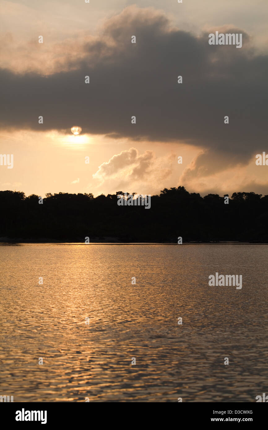 Sunset and rain clouds across the River Essequibo. North Rupununi ...