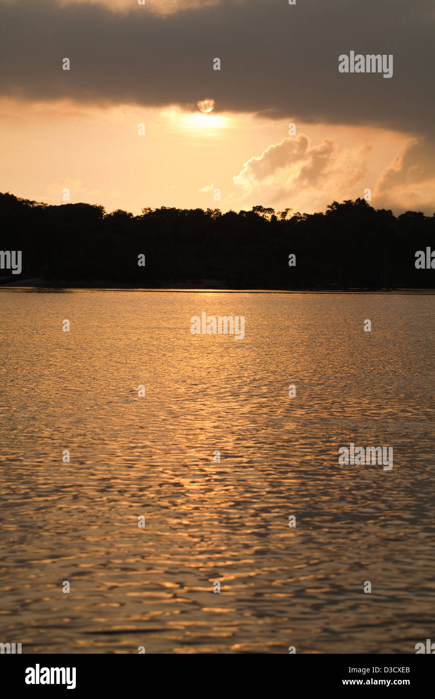 Sunset and rain clouds across the River Essequibo. North Rupununi ...