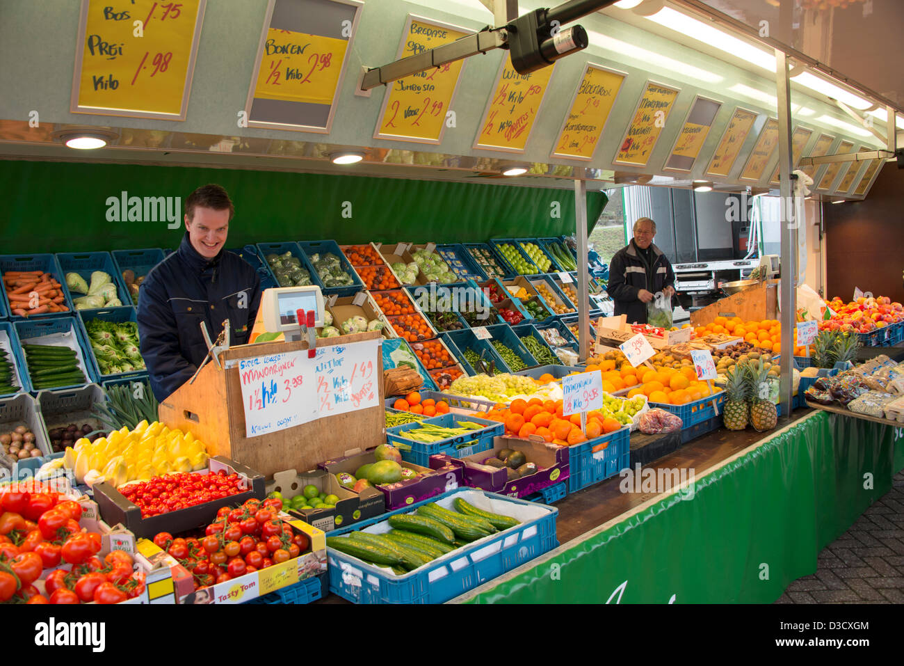 two men with fruit stall on the market in Holland Stock Photo - Alamy