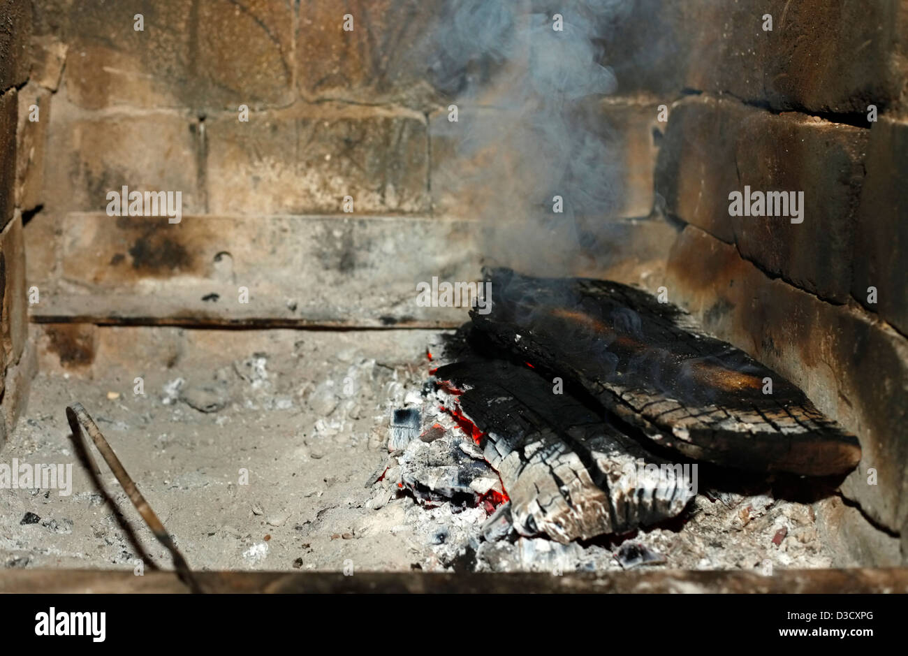 Fireplace with coal and a smoke Stock Photo - Alamy