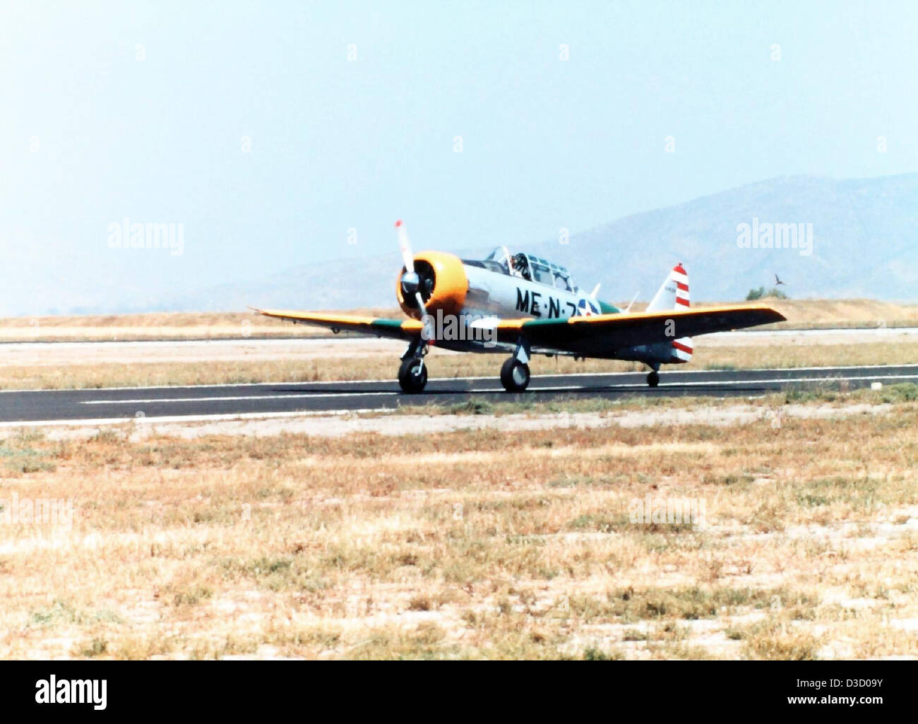 This image features a North American AT-6 Texan, a single-engine ...