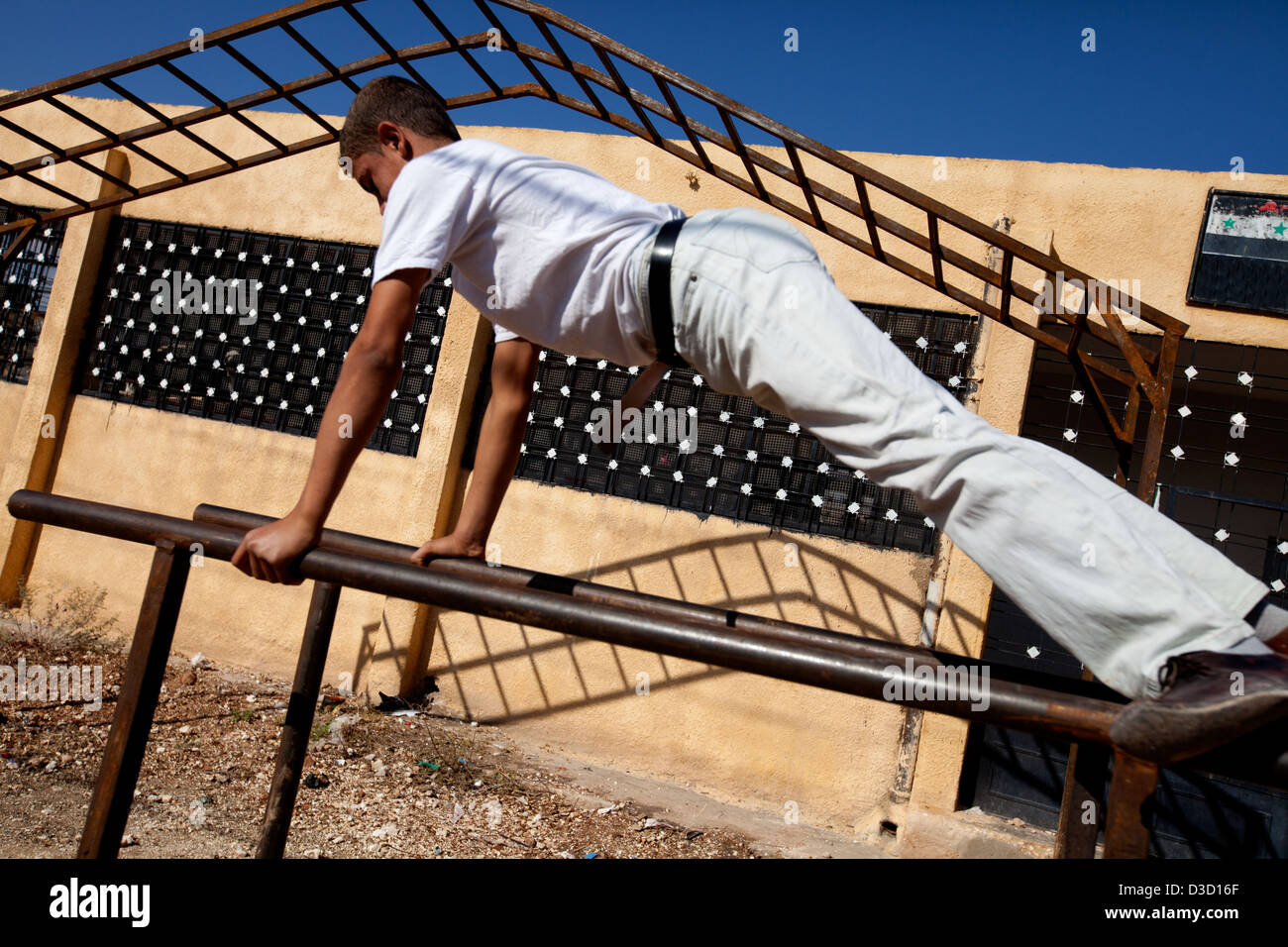 Free Syrian Army youth soldiers attend a training camp in Syria. Their ...