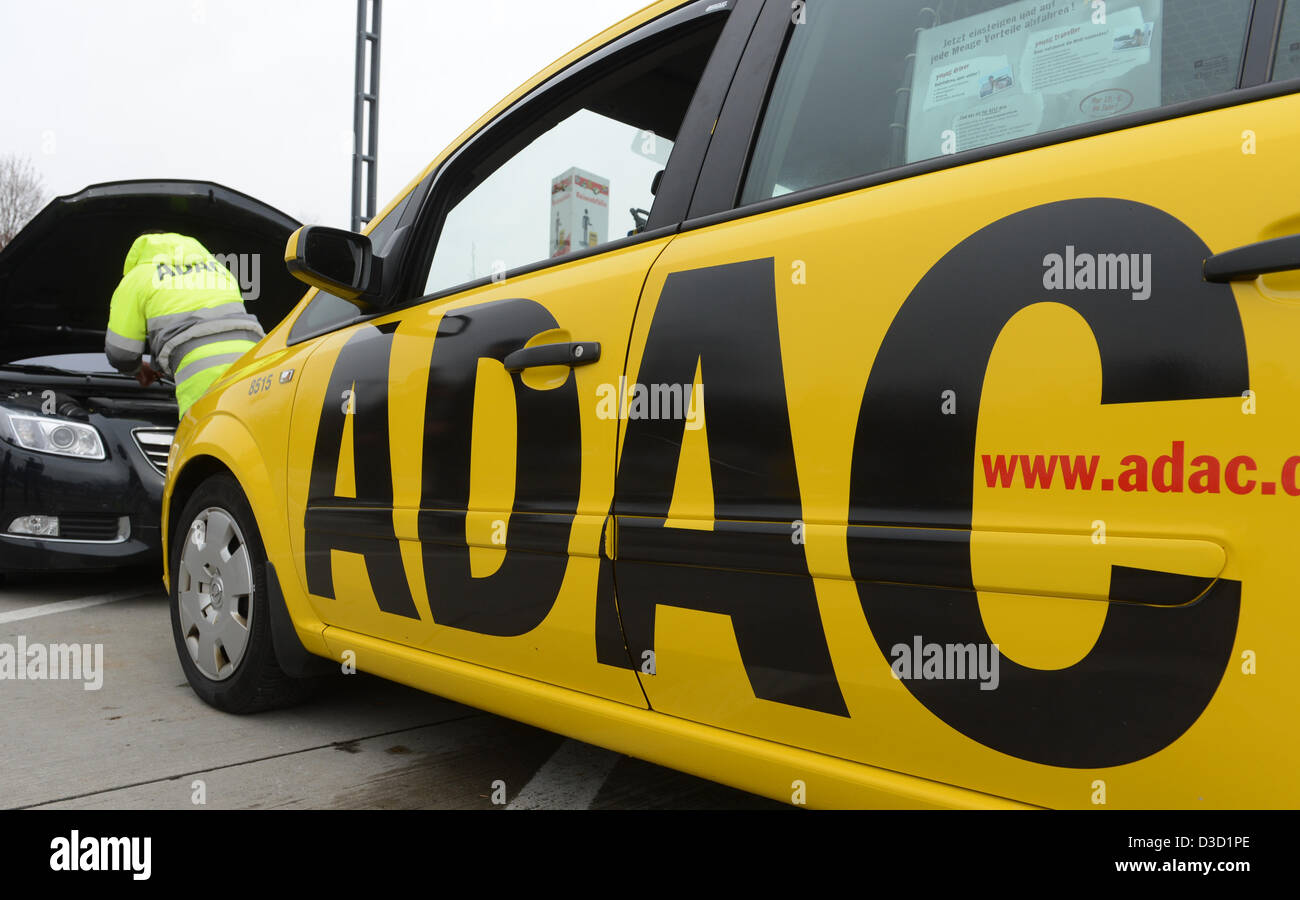 ADAC road patrol driver Kai Maier (L) shows how to short a car battery ...