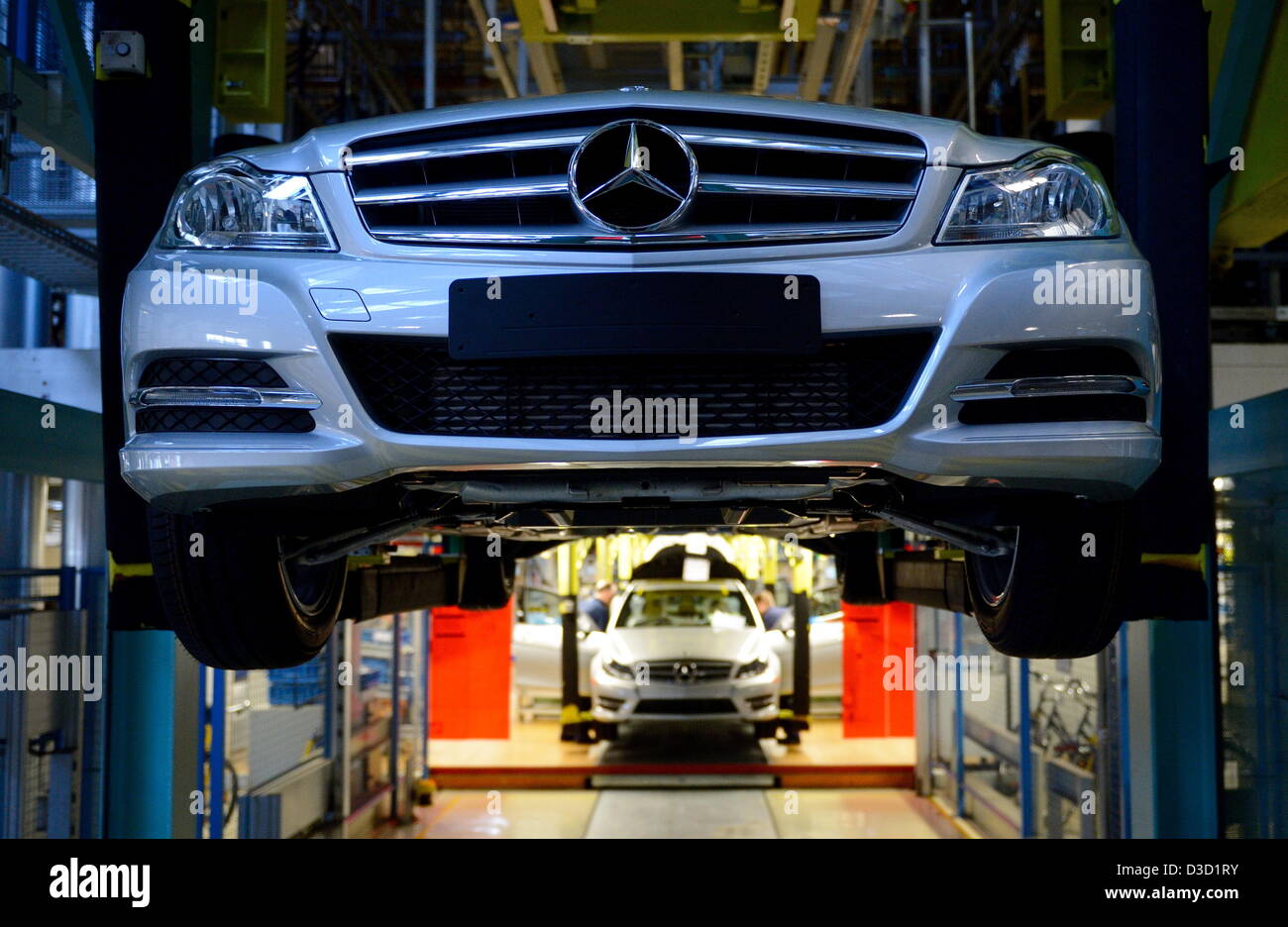 Workers put together a Mercedes C-Class on production lines at the ...