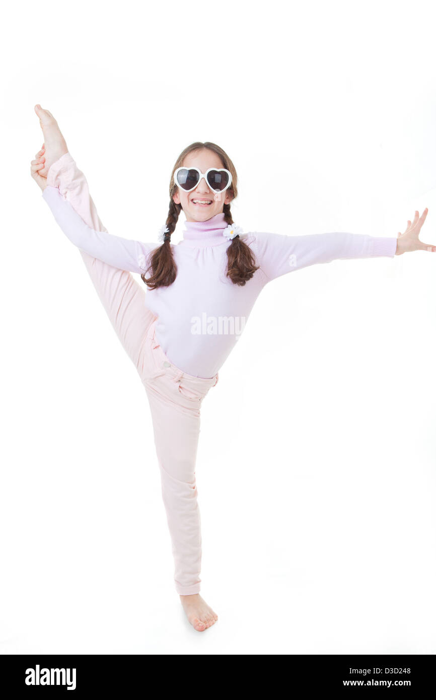 Happy smiling child gymnast exercising or dancing Stock Photo - Alamy