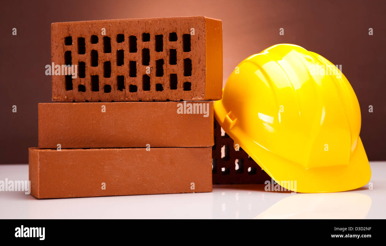 Hard hat with bricks Stock Photo - Alamy