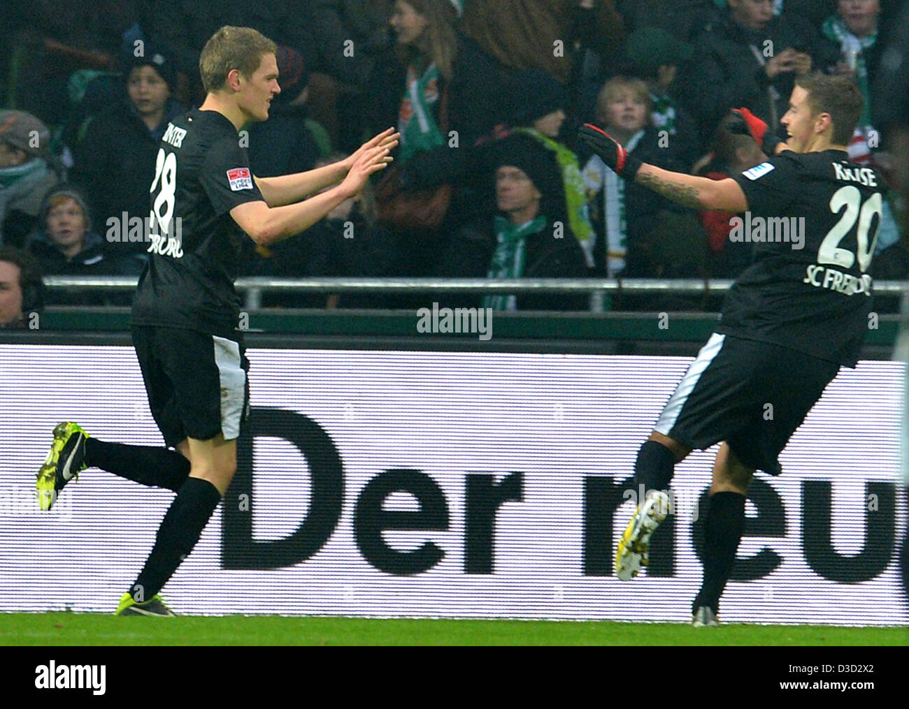 Freiburg's Max Kruse (R) celebrates his 3-2 goal with Matthias Ginter ...