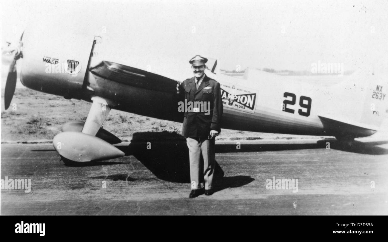 This image captures aviation pioneer Roscoe Turner standing next to his ...
