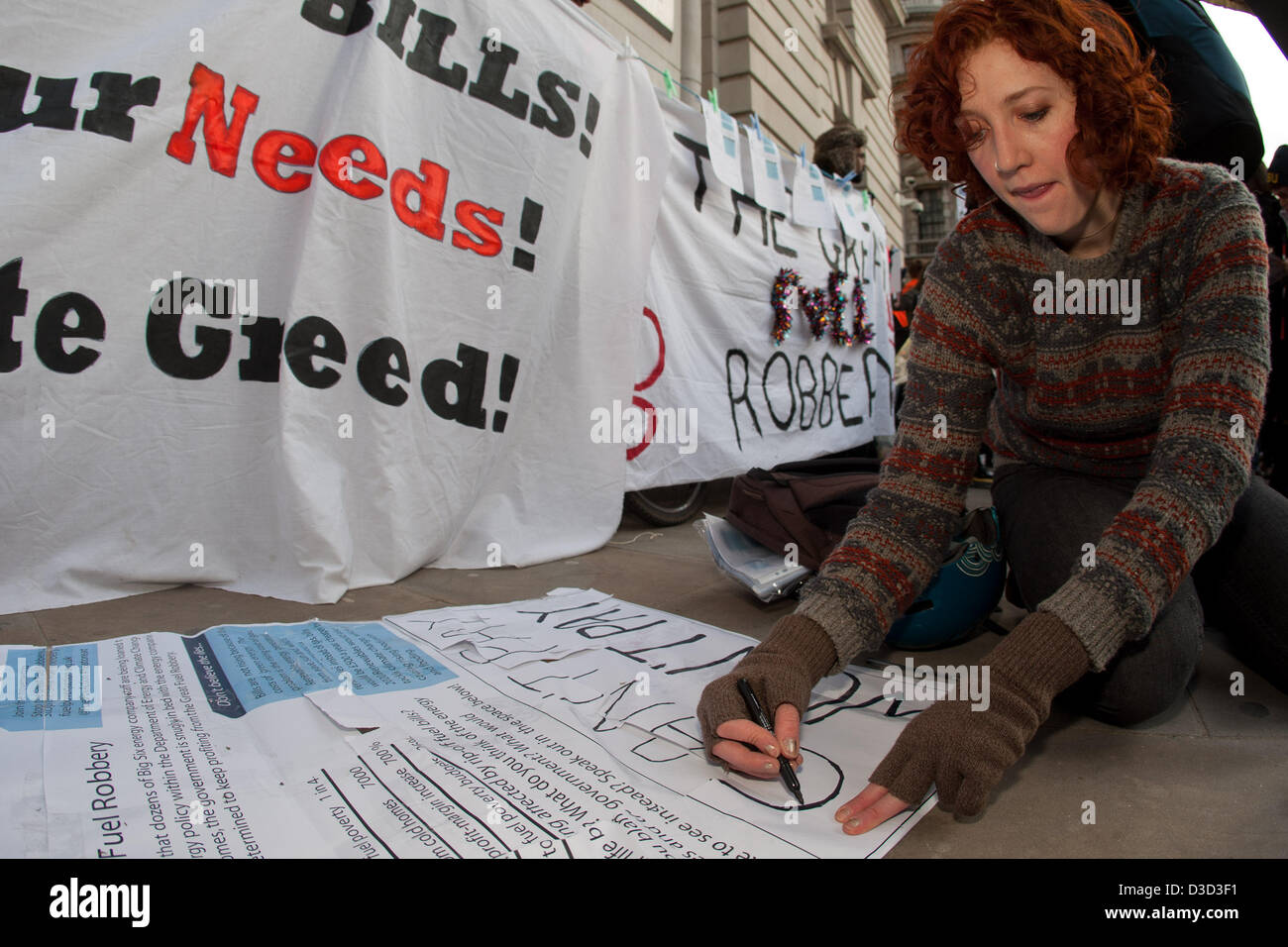 Activist making placards outside the Department of Energy & Climate ...