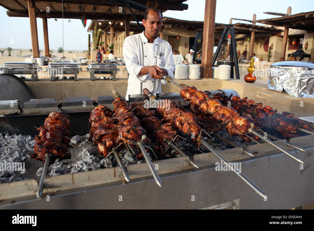 Dubai, United Arab Emirates, chef puts a skewer with Grillhaehnchen ...