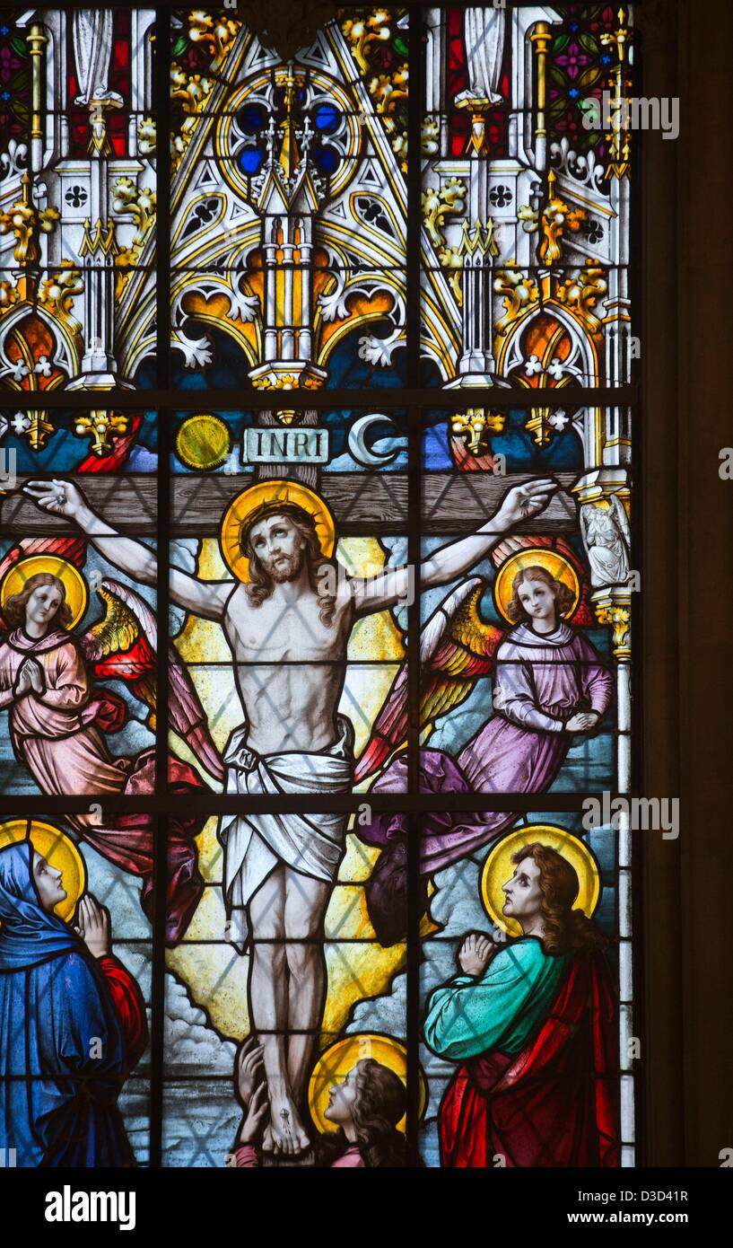 A colored glass window with biblical figures is pictured in the church ...
