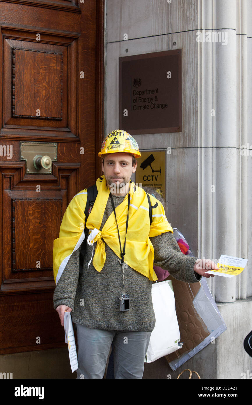 Activist hands out leaflets outside the Department of Energy & Climate ...