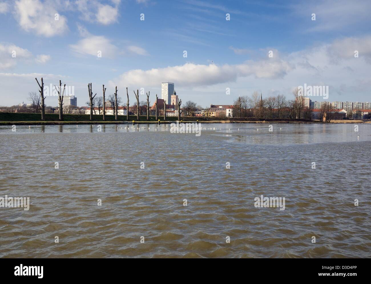 Ripples and waves form on a side arm of the Oder river in Slubice ...