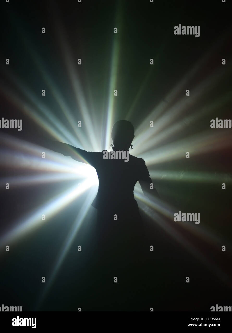 Silhouette of dancing girl in rays of light Stock Photo - Alamy