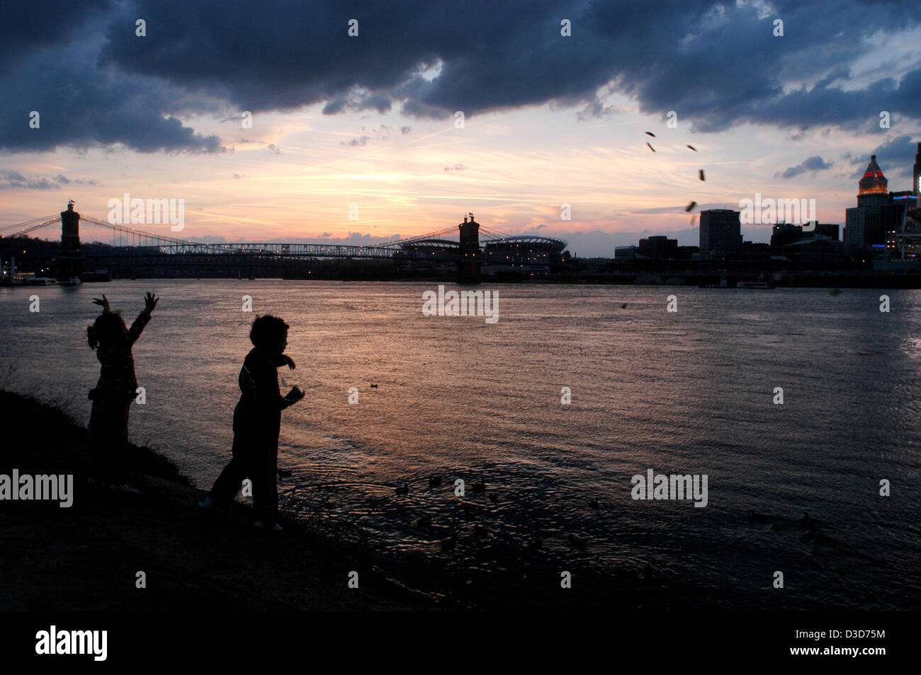 Children playing by the river at sunset hi-res stock photography and ...