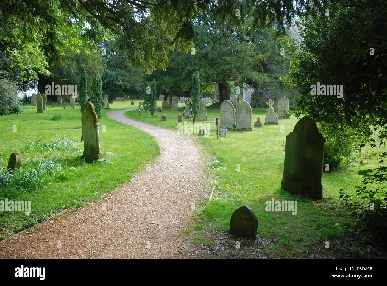 Path through a church graveyard with stones to either side Stock Photo ...