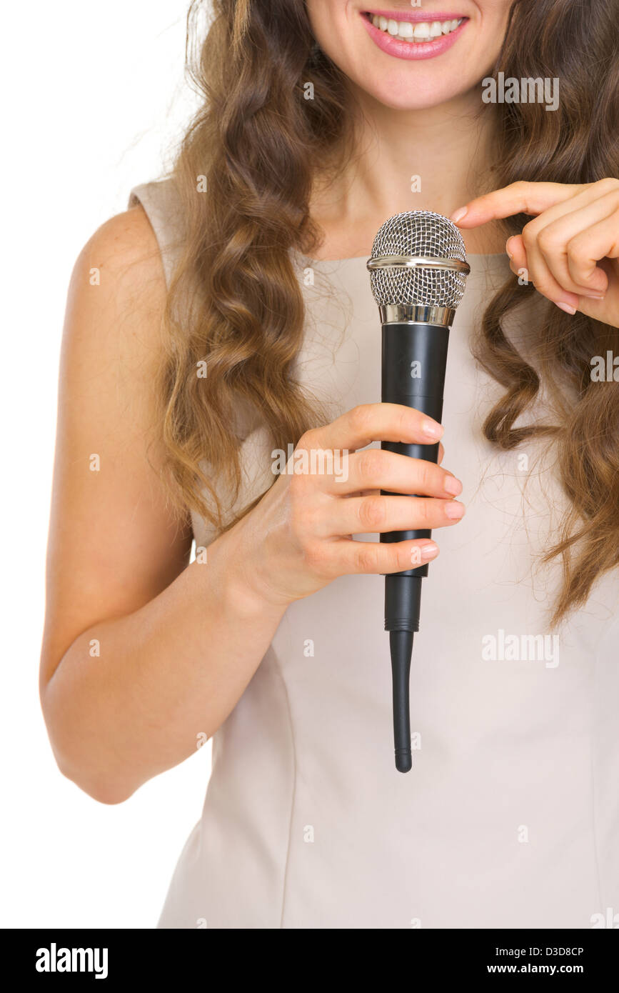 Closeup on young woman tapping on microphone to check sound Stock Photo ...