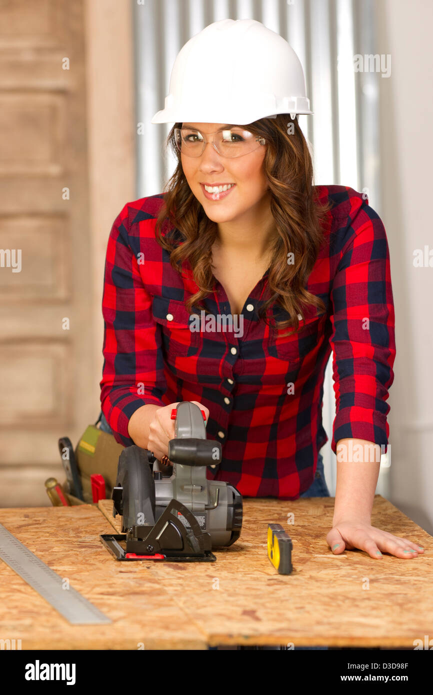 A Female works on a building project in the shop Stock Photo - Alamy