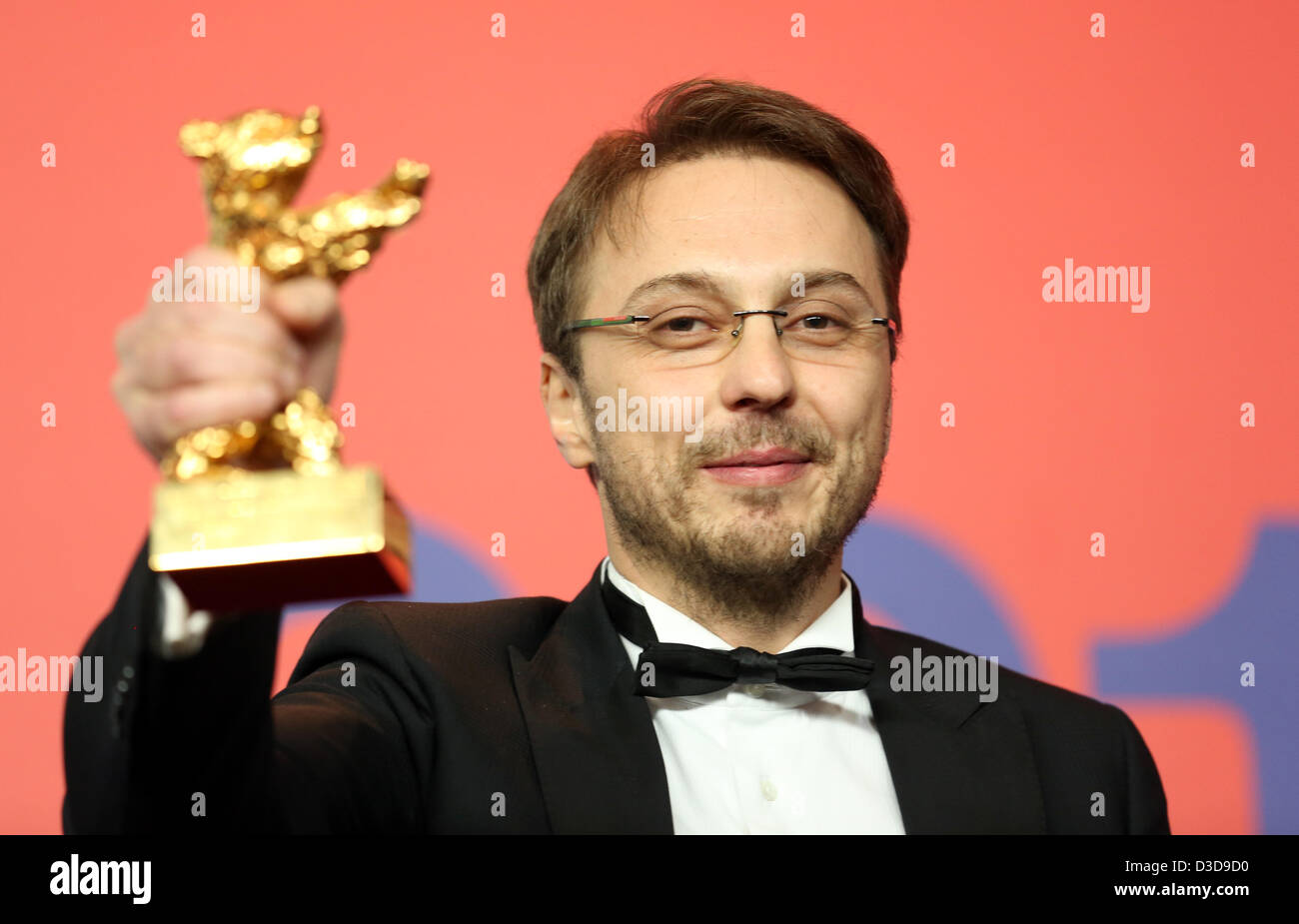 Director Calin Peter Netzer poses with the Golden Bear for Best Film ...