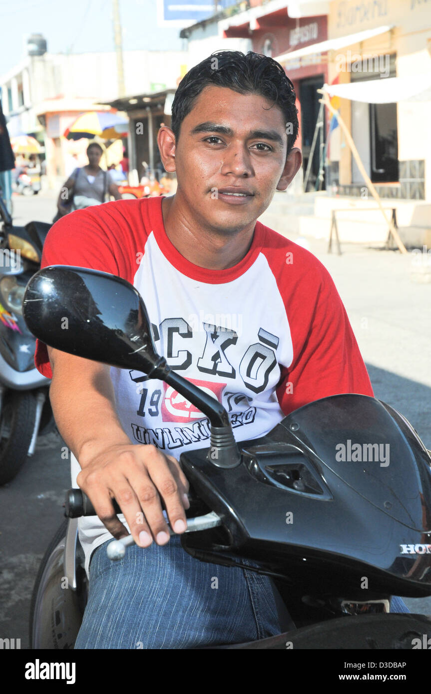 A Guatemalan man poses on his scooter Stock Photo - Alamy