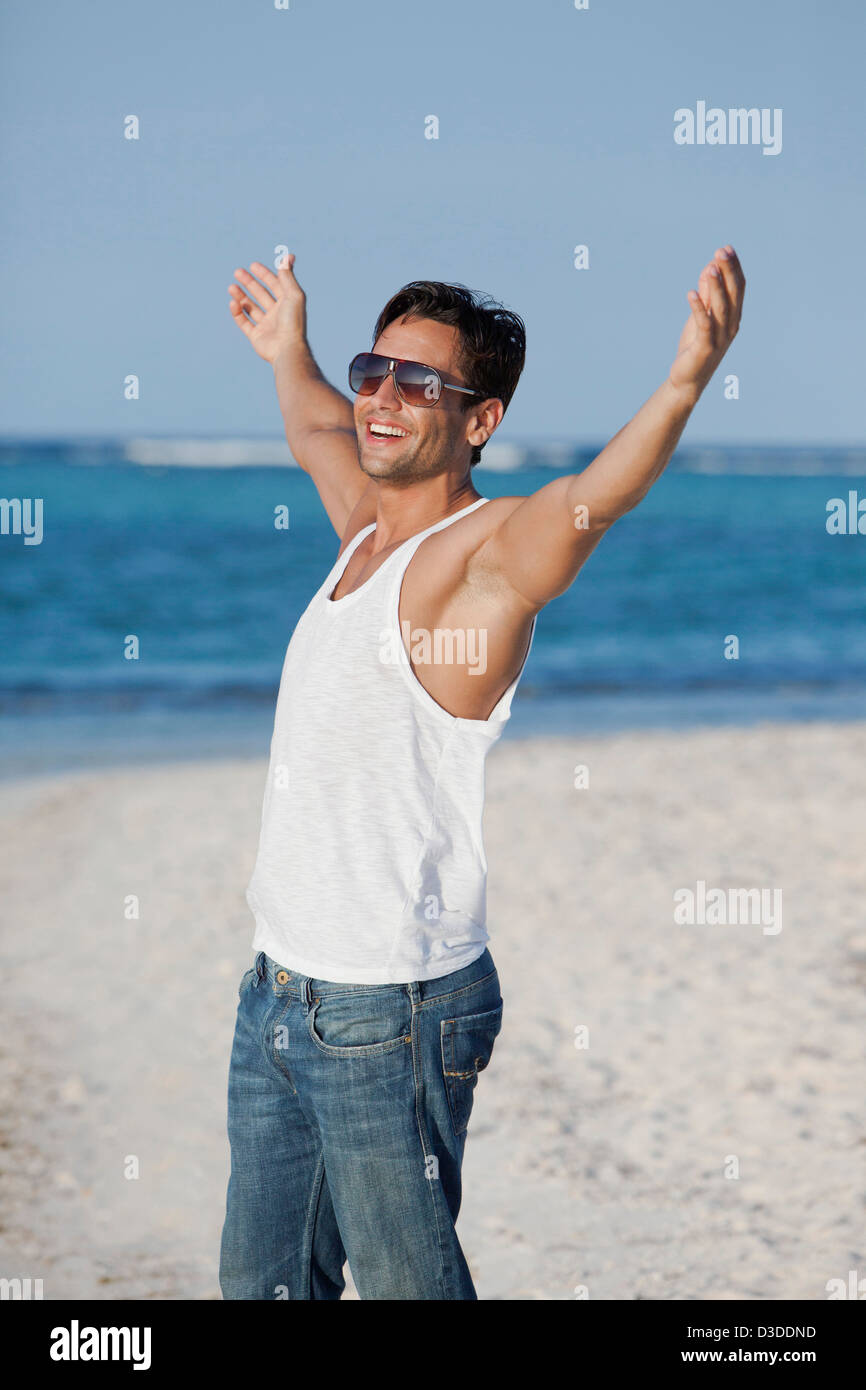 Man enjoying on the beach Stock Photo - Alamy