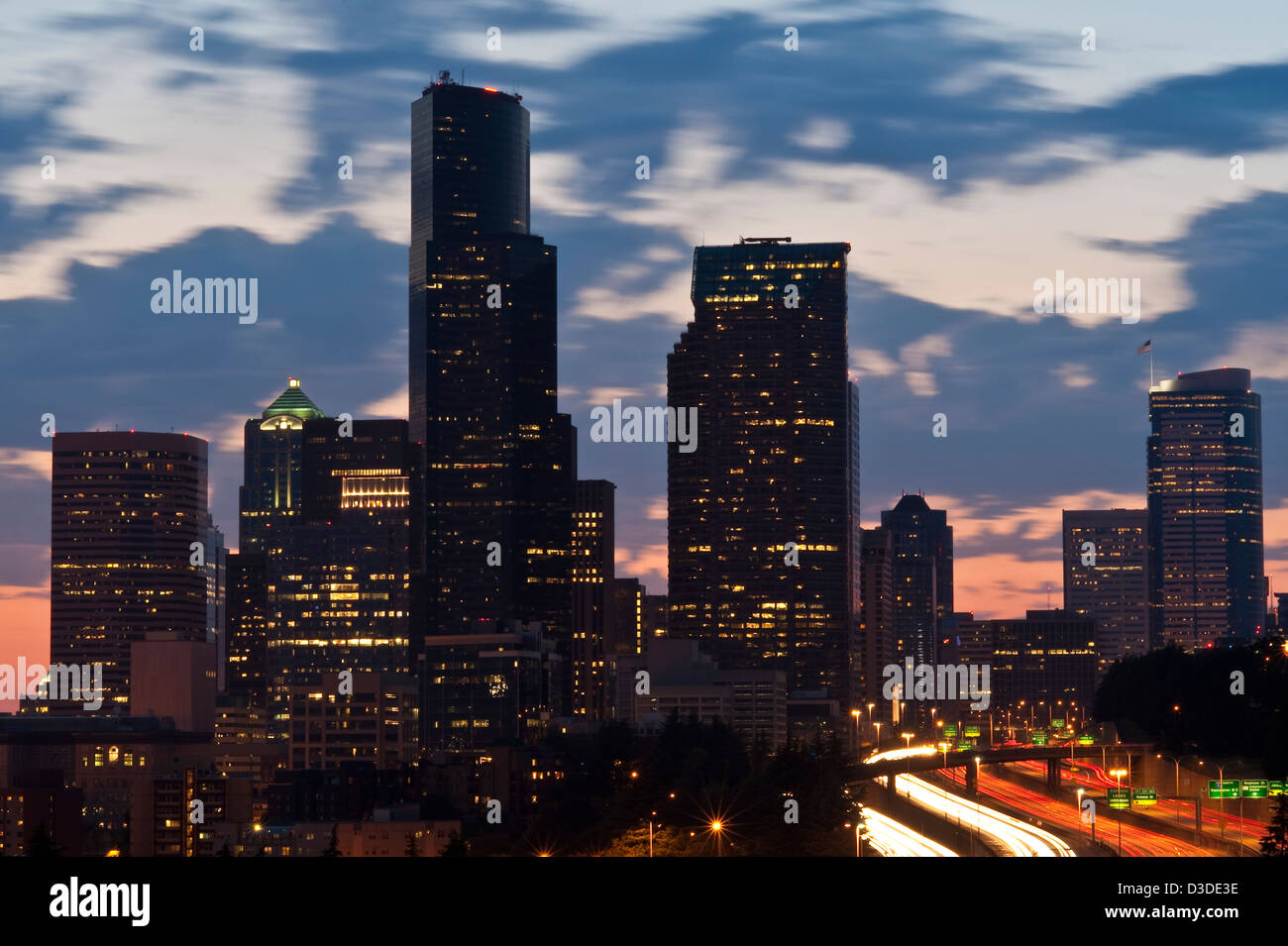 Seattle skyline sunset with city lights and car traffic on I-5 Stock ...