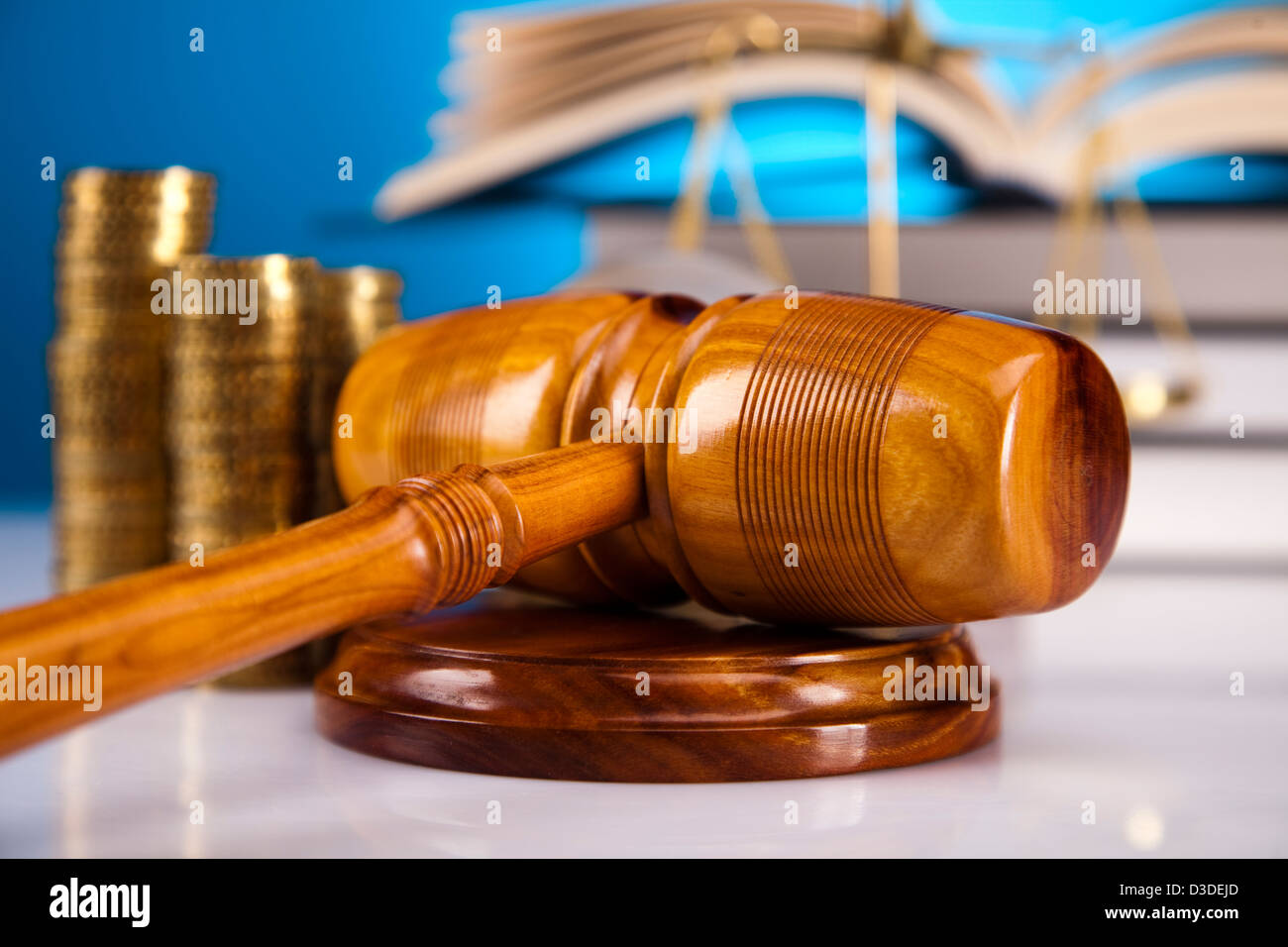 Justice Scale, Gavel and coins on blue background Stock Photo - Alamy