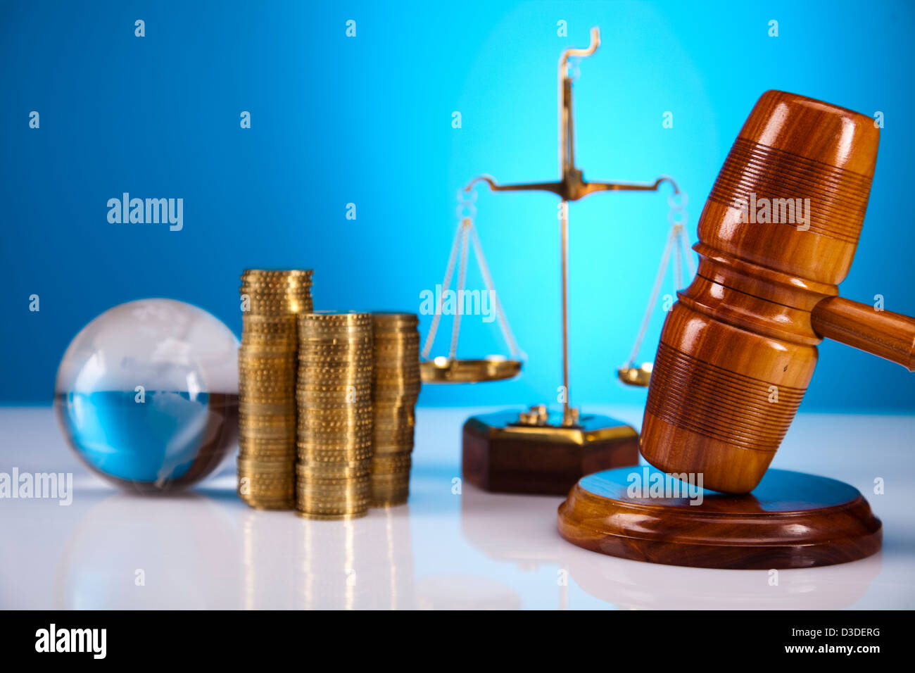 Justice Scale, Gavel and coins on blue background Stock Photo - Alamy