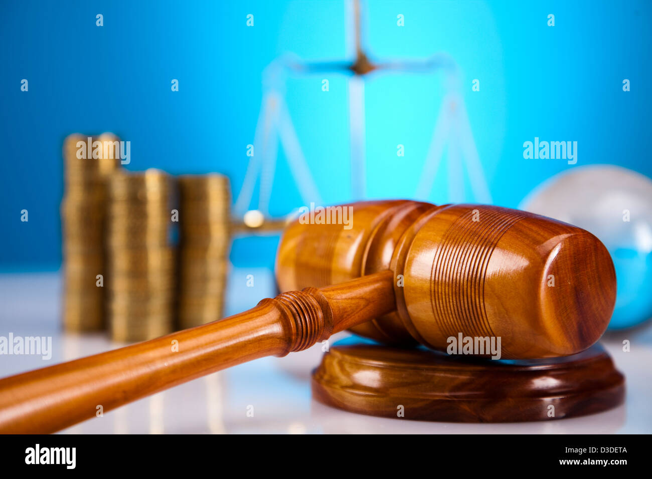 Justice Scale, Gavel and coins on blue background Stock Photo - Alamy
