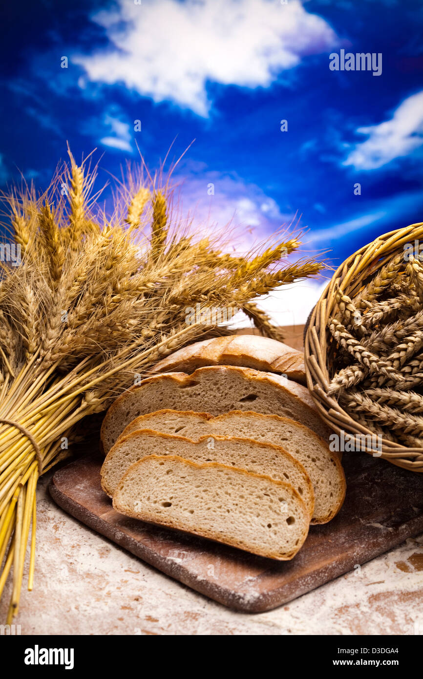 Assortment of baked bread on blue sky background Stock Photo - Alamy