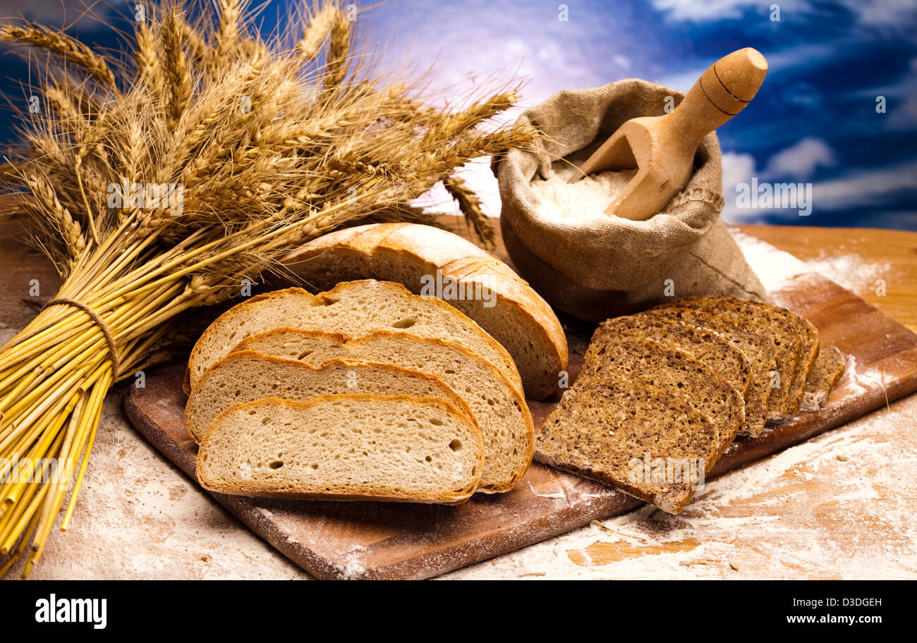 Assortment of baked bread on blue sky background Stock Photo - Alamy