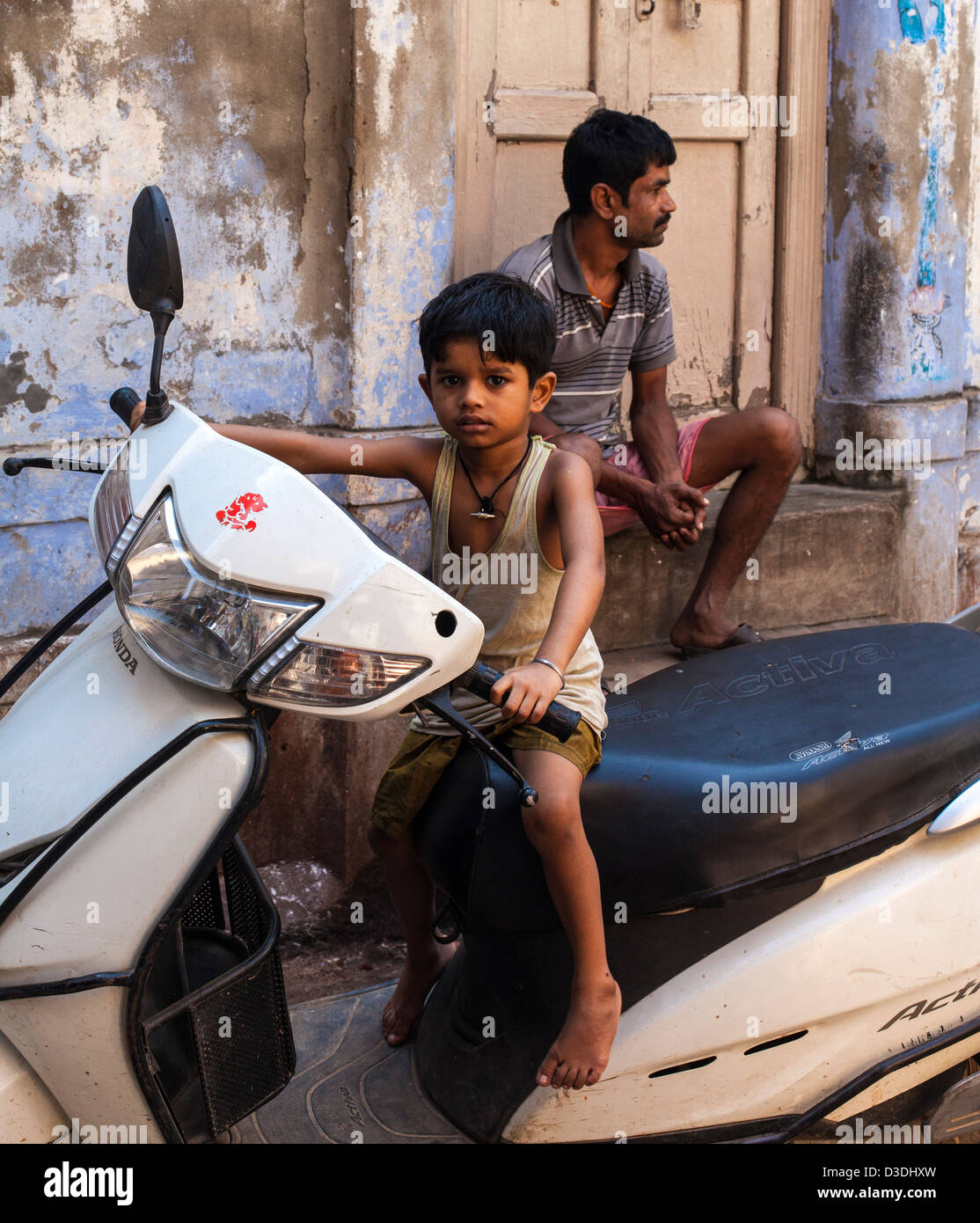young Indian boy sitting on a motorbike, Varanasi, India Stock Photo ...
