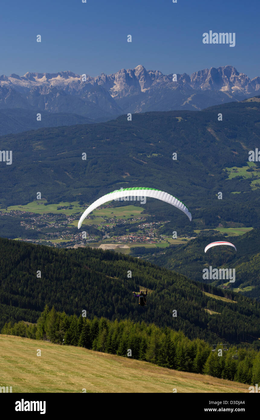 Paraglider over Gerlitzen (near Ossiach, Carinthia) with Austrian alps ...