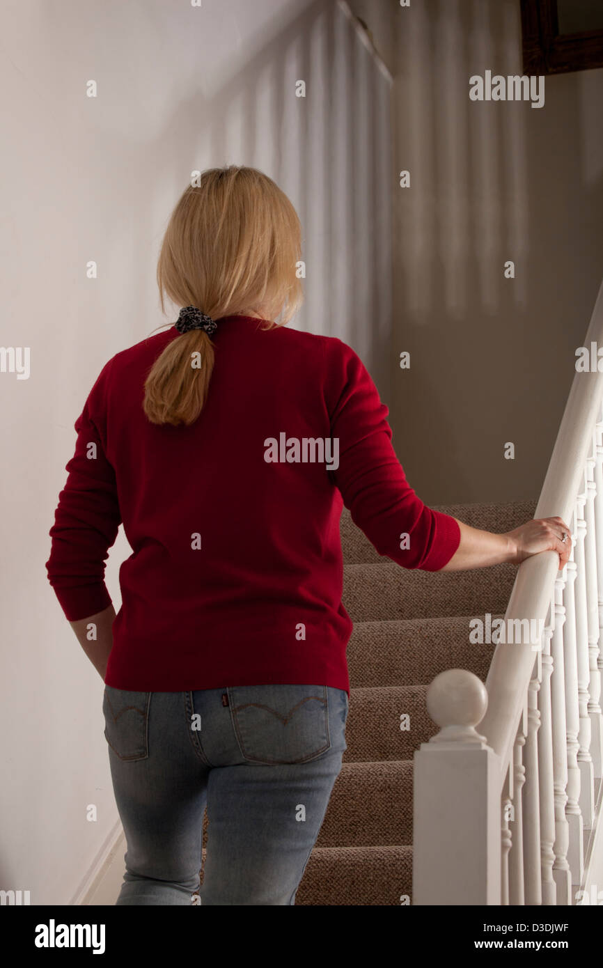 Person walking upstairs hi-res stock photography and images - Alamy