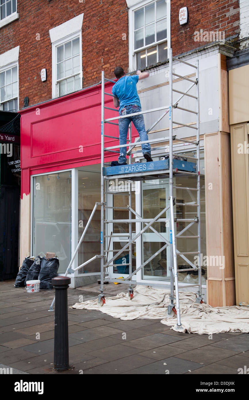 Zarges Mobile Scaffolding being used by workman to decorate & refurbish shop front in Darlington ...