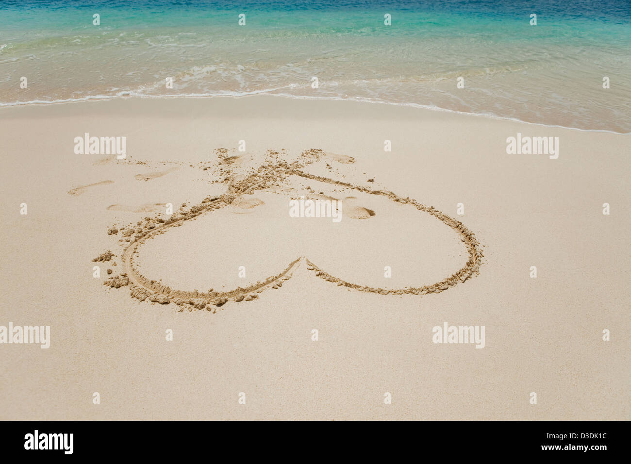 Heart in sand Stock Photo - Alamy