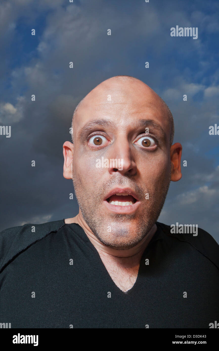 Man looking shocked in fear Stock Photo - Alamy